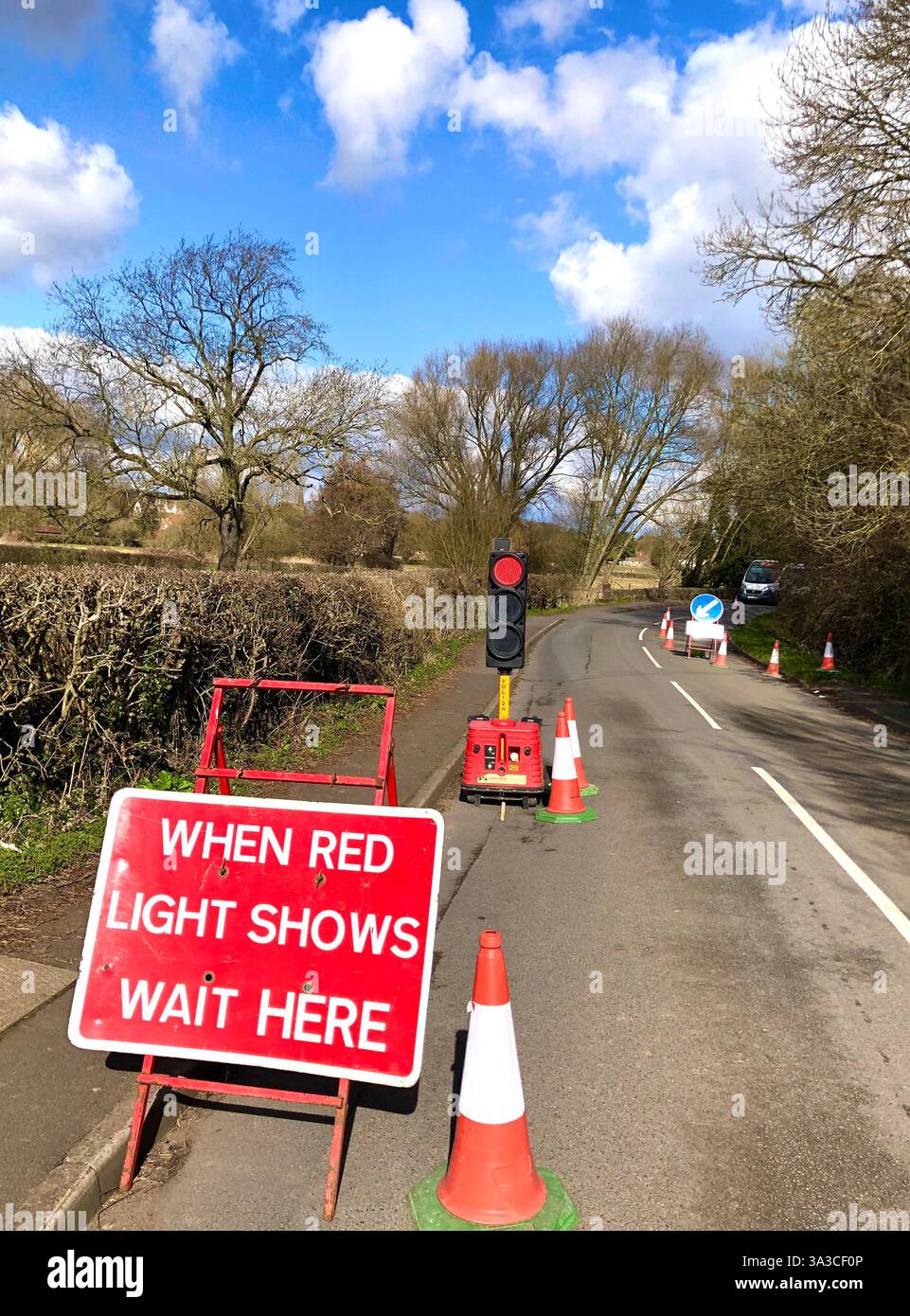 Temporary traffic lights on a country lane in rural England Stock Photo ...