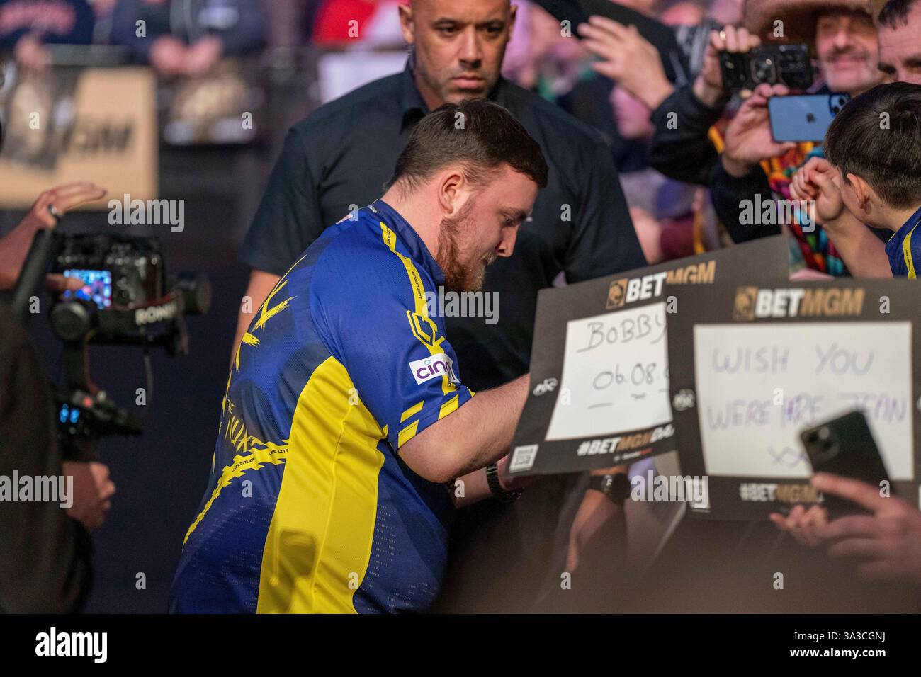 Luke Littler signs autographs during the BetMGM Premier League Darts ...