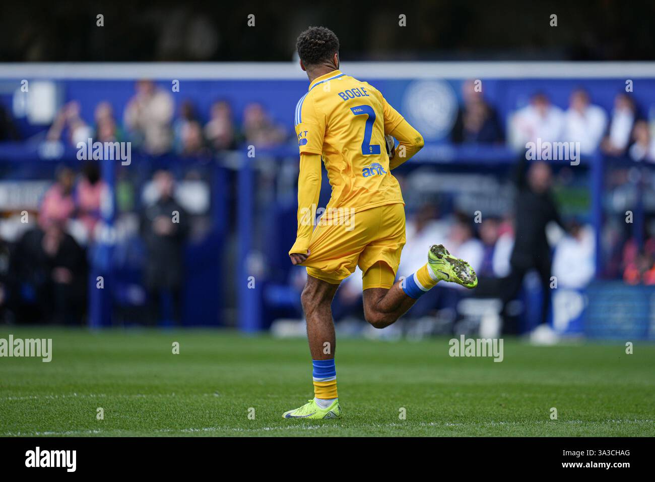 Jayden Bogle of Leeds United runs back after goal to get game restarted ...