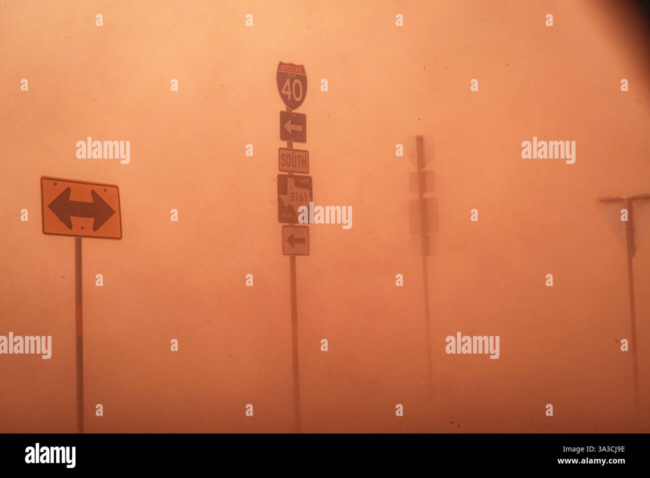 Road signs along the highway during a dangerous spring dust storm near ...