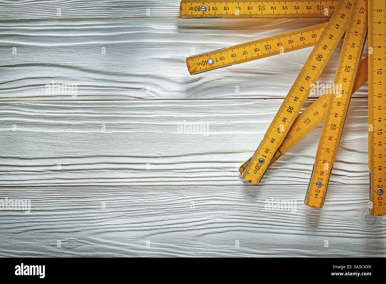 Wooden meter on white board Stock Photo - Alamy