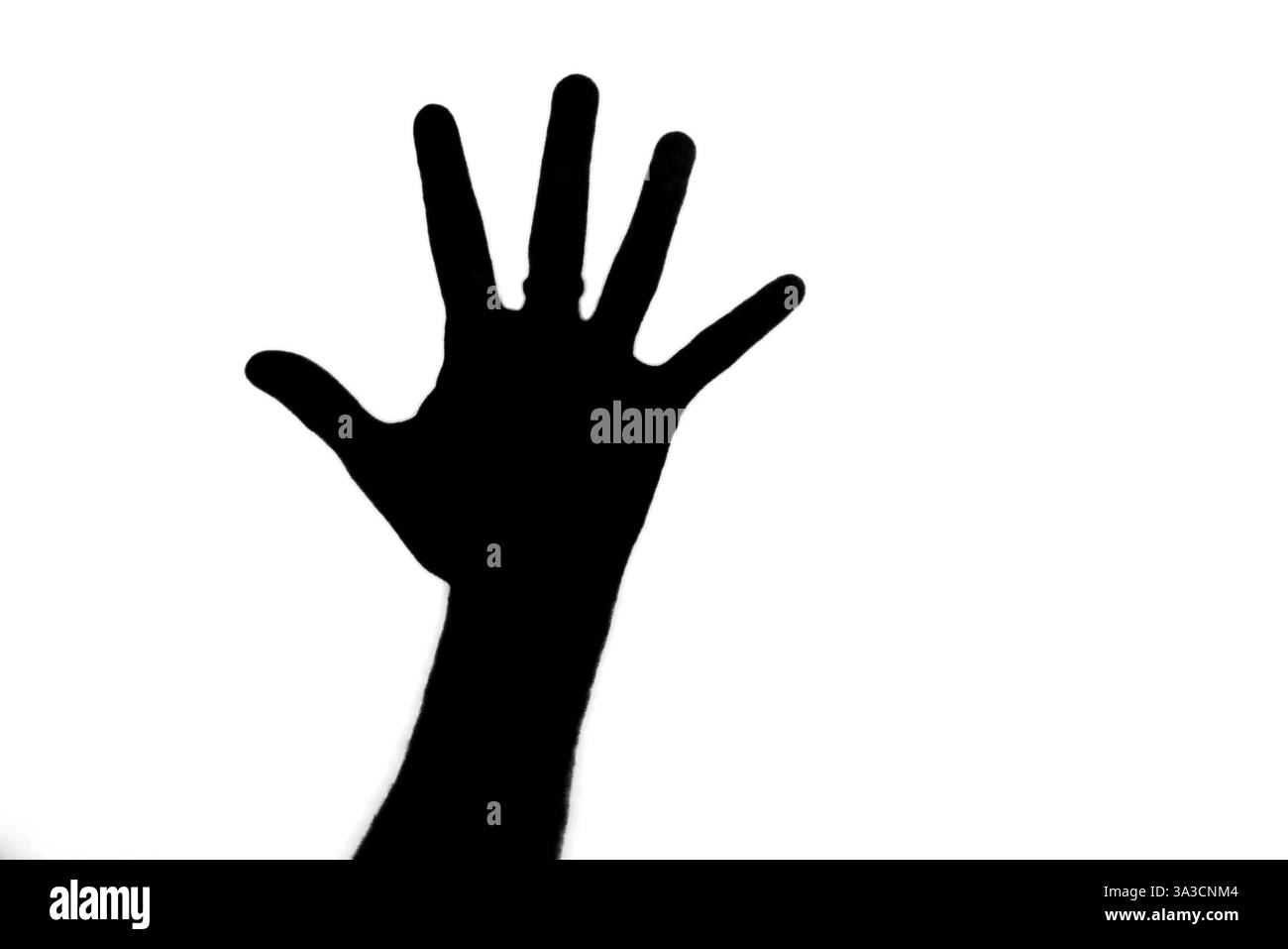 Shadow image, black and white silhouette of a hand with five fingers ...