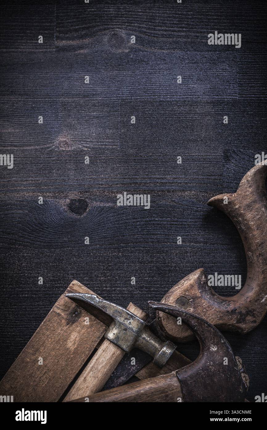 Vertical view of vintage square ruler claw hammers hand saw Stock Photo ...