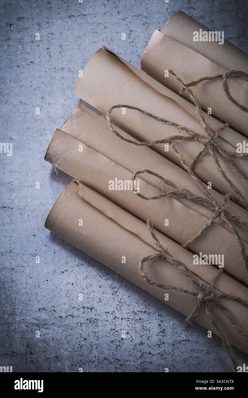 Stack of medieval paper scrolls on scratched metallic background Stock ...