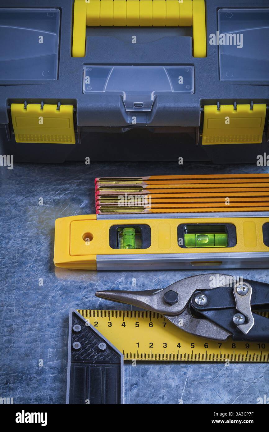 Toolbox construction level wooden meter try square and steel cutter on ...