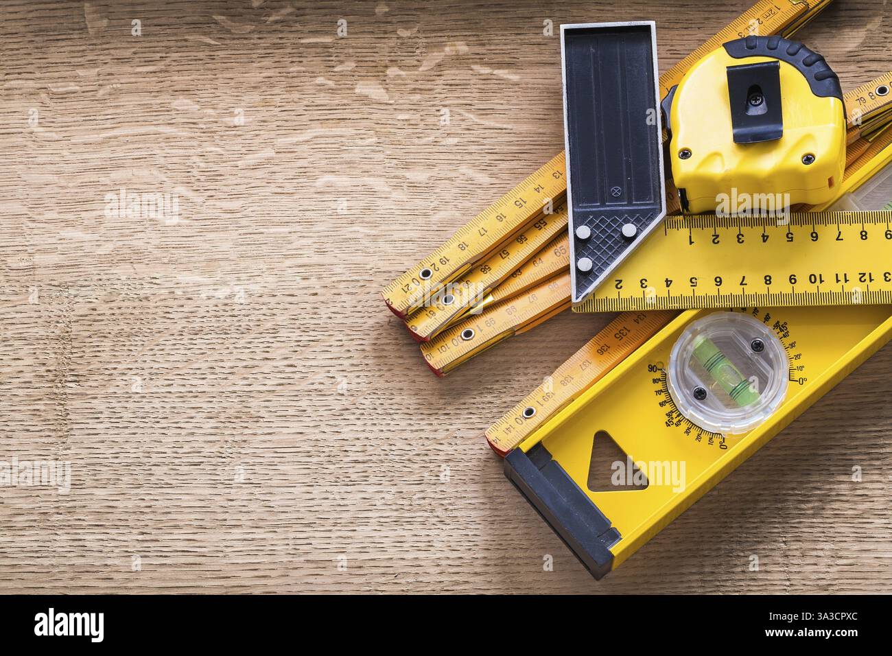 Working tools of measurement on oaken wooden board construction concept ...