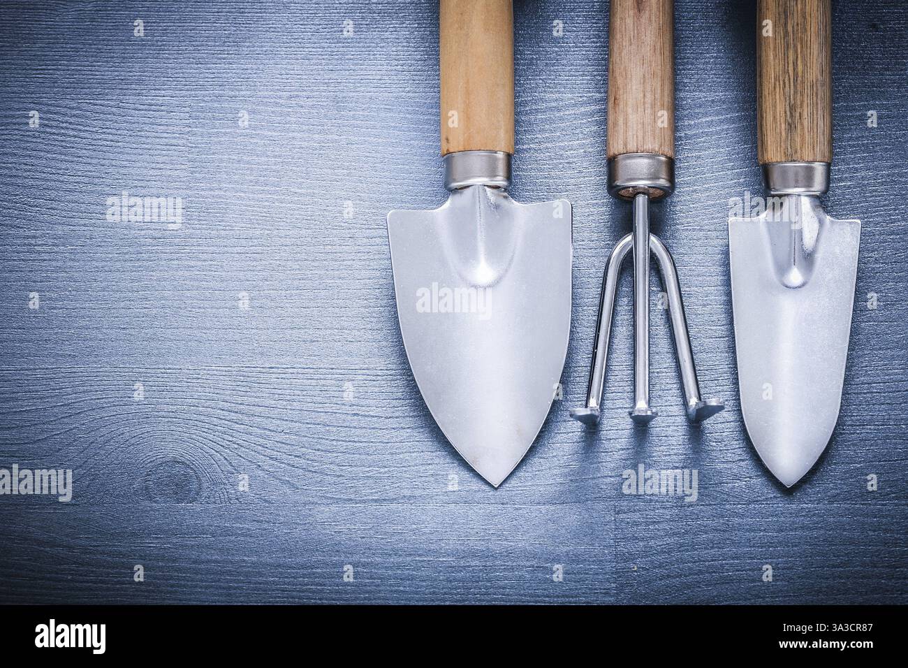 Two little garden spades and fork with copyspace Stock Photo - Alamy