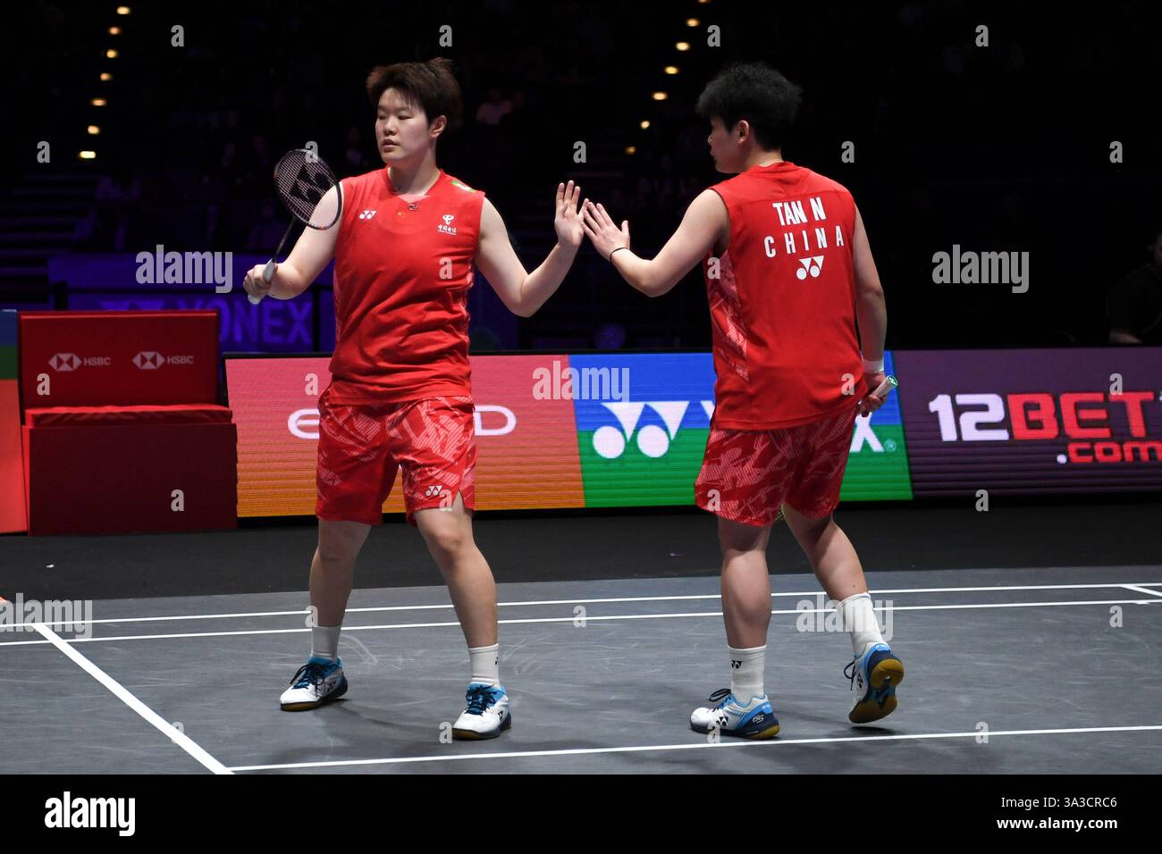Tan Ning, left, and Liu Sheng Shu of Chinaafter scoring point against ...