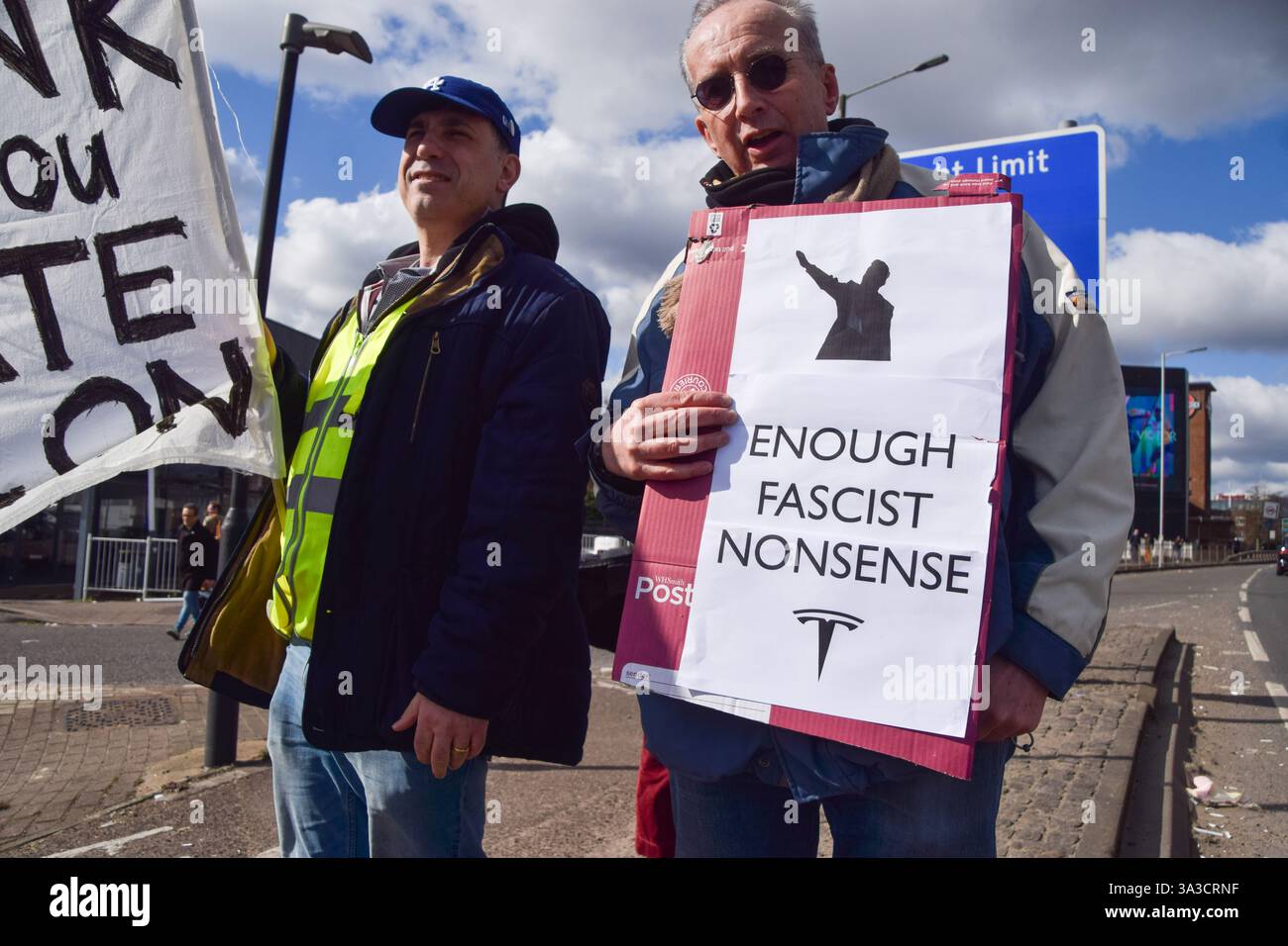 London, England, UK. 15th Mar, 2025. A protester holds an anti- Elon ...