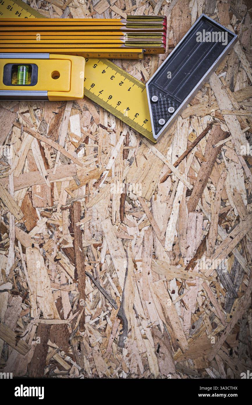 Square ruler construction level wooden meter on chipboard copyspace ...