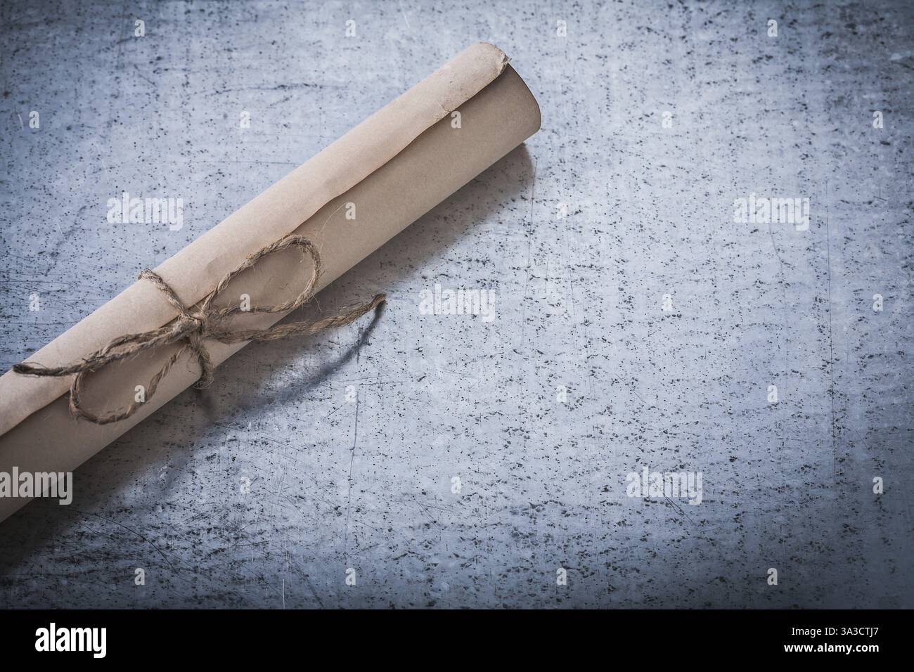 Vintage rolled corded paper on scratched metallic background Stock ...