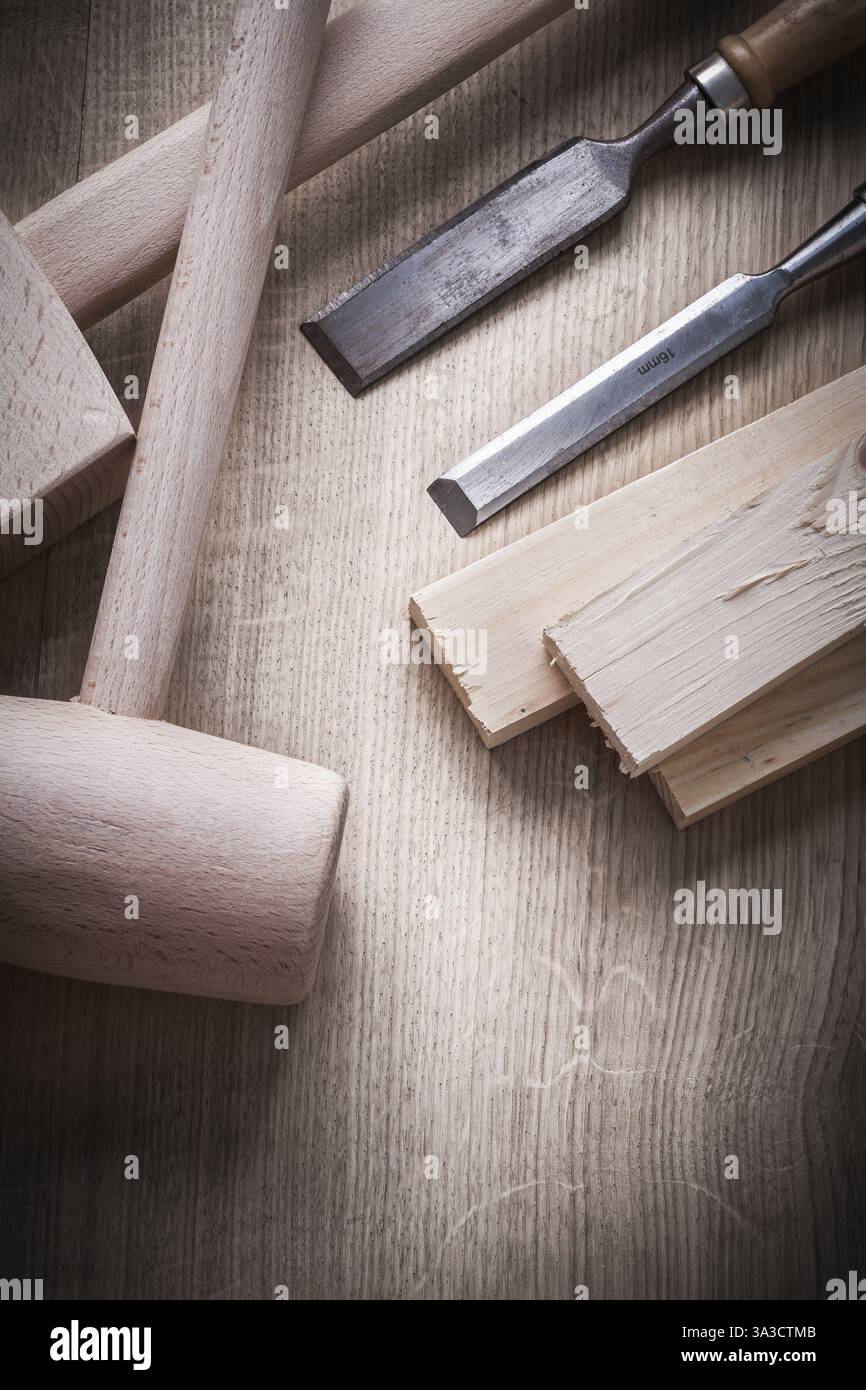 Wooden building boards hammers flat chisels on wood background ...