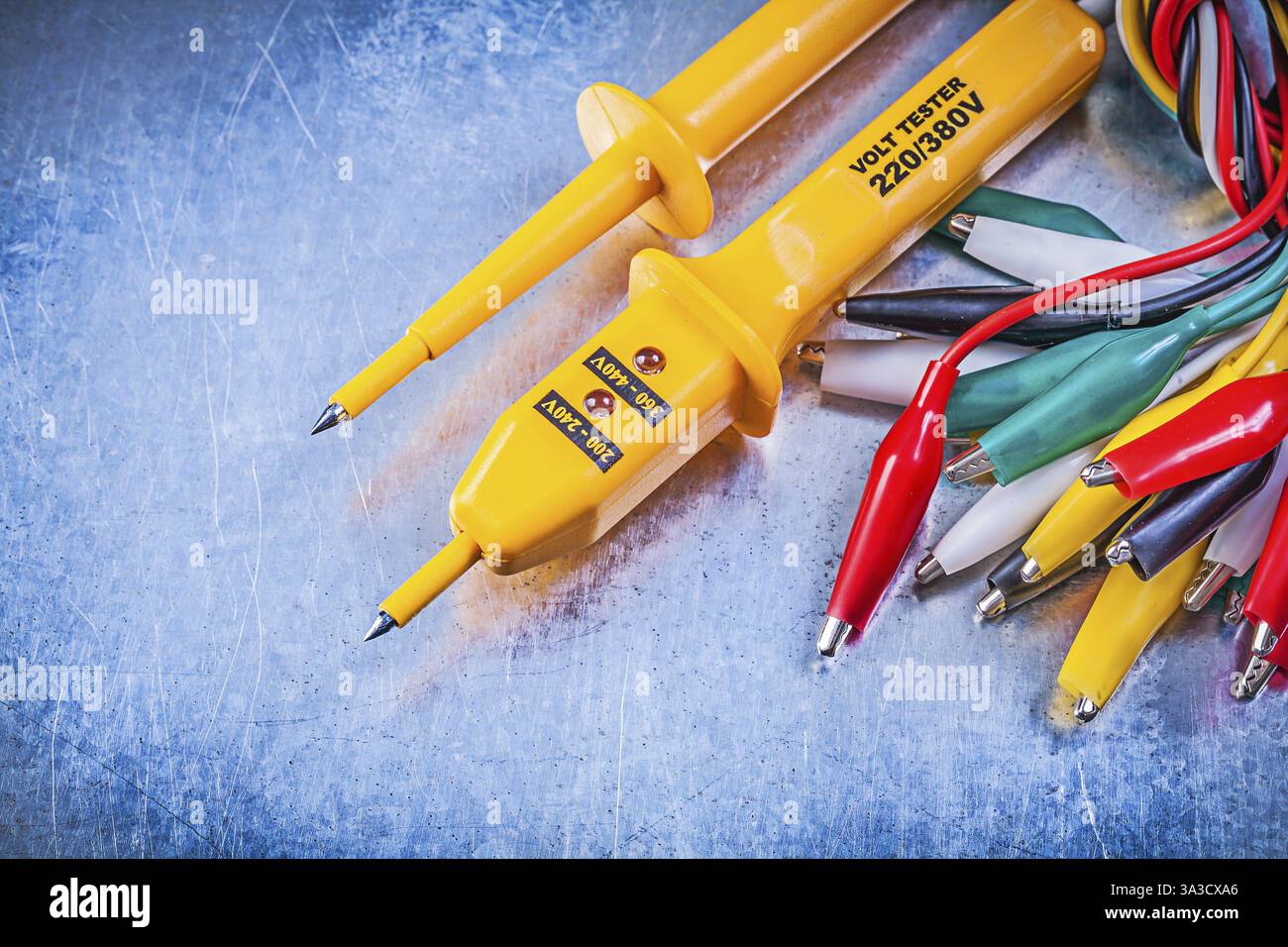 Yellow electrical tester set of multicolored crocodile clip cables on ...