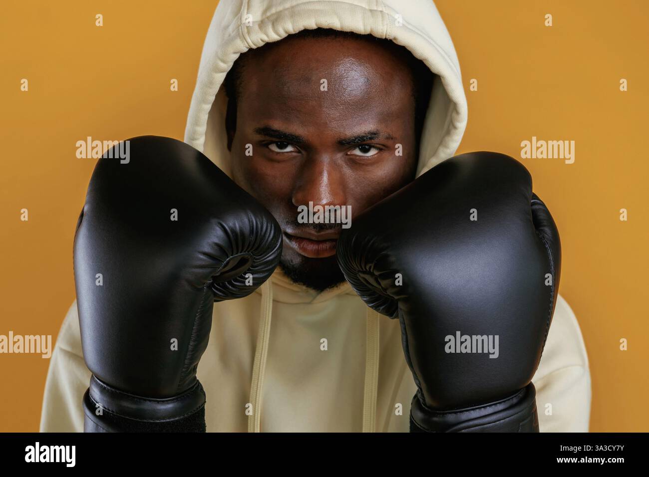 In hood. Boxer is ready to fight. Black guy is against yellow ...