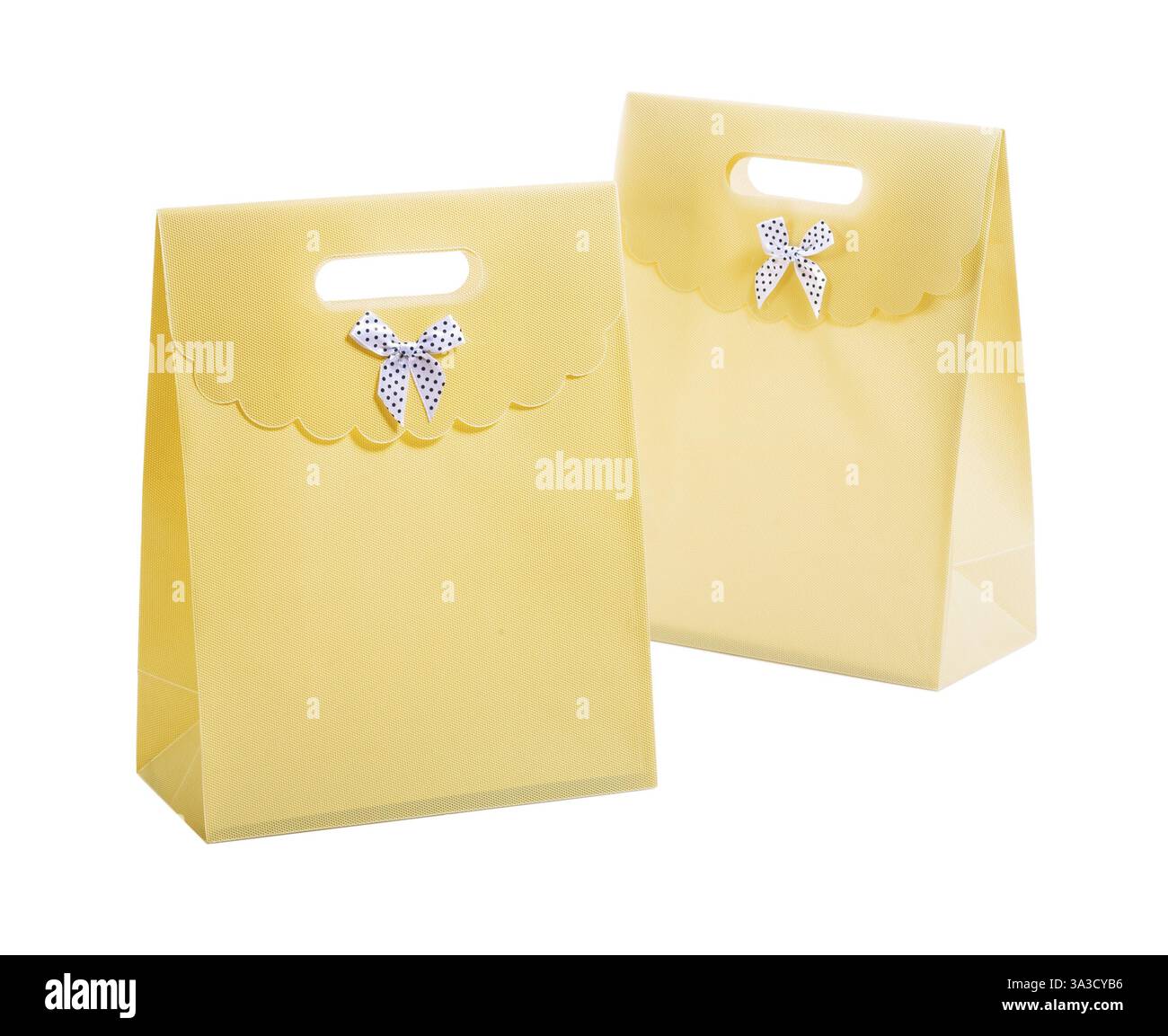 Two yellow paper bags isolated Stock Photo - Alamy