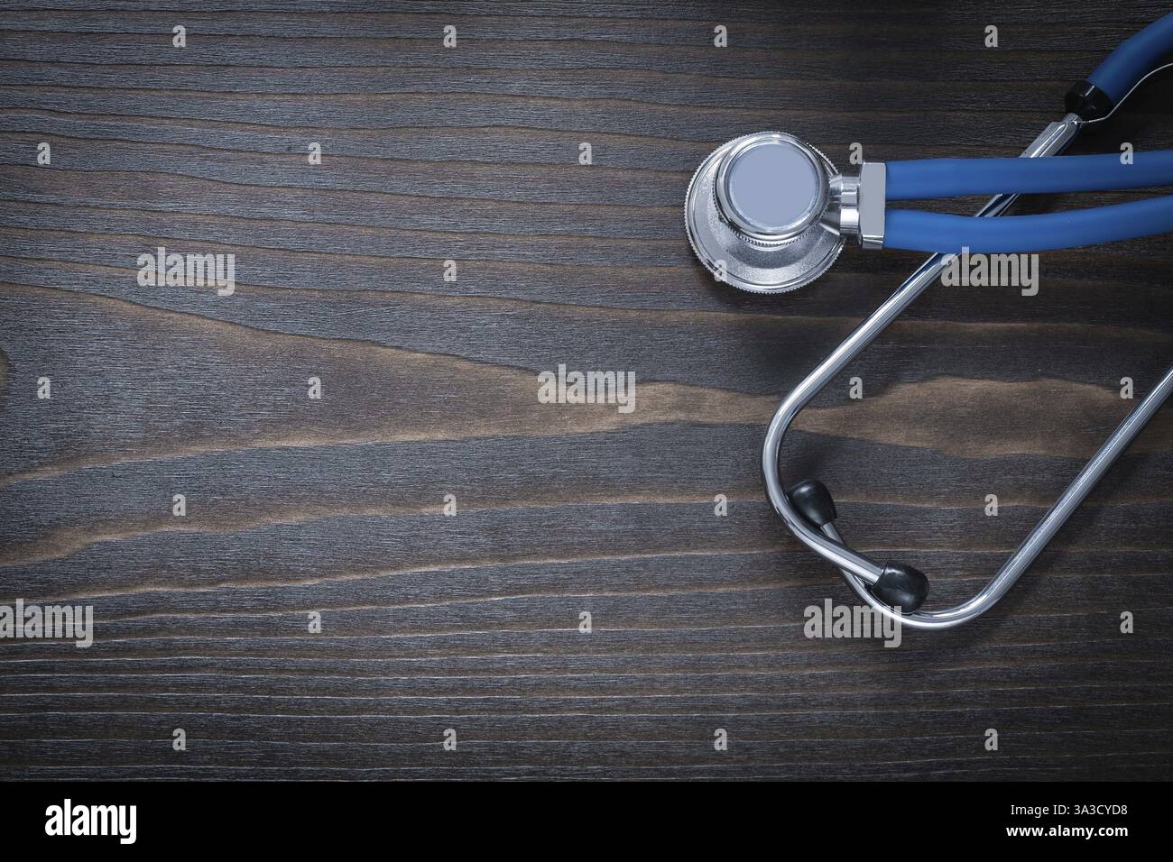 Wooden vintage board with blue medical diagnostic device medicine ...