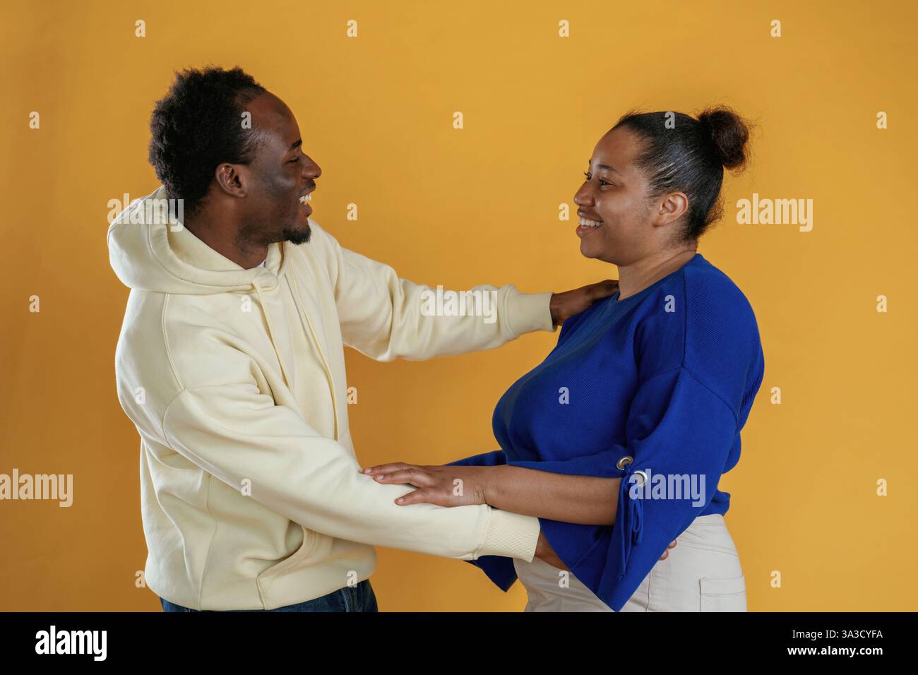 Happy to see each other. About to hug. Black couple are together ...