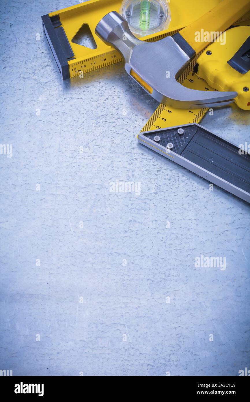 Vertical view of claw hammer tape measure construction level square ...