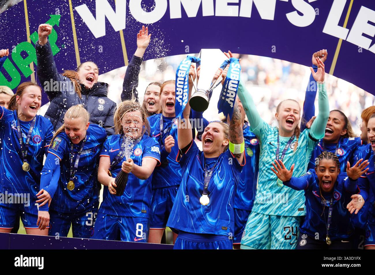 Chelsea's Millie Bright lifts the trophy after winning the Subway Women ...