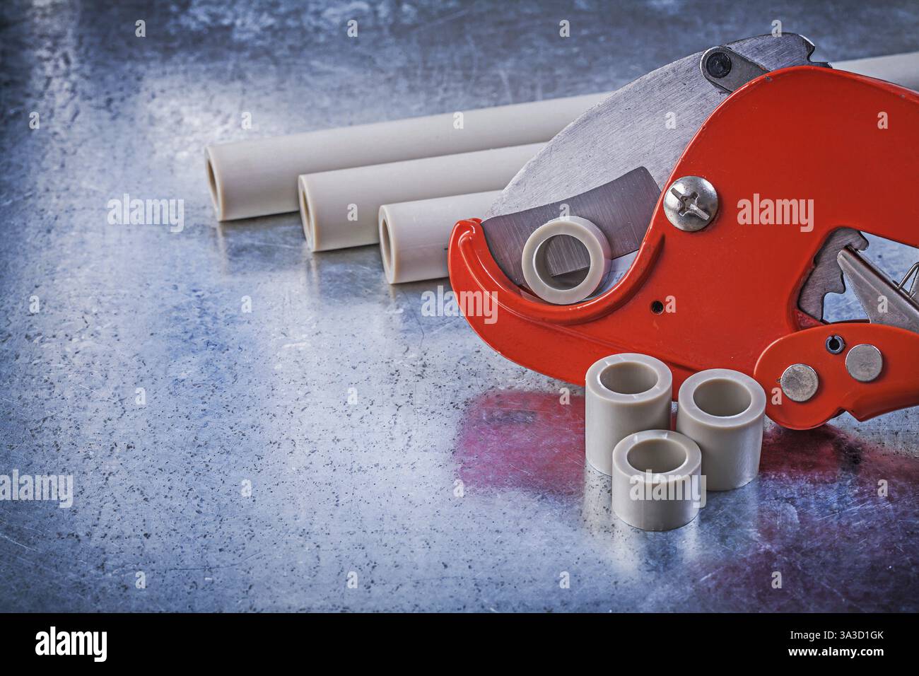 Water pipe cutter on metallic background construction concept Stock ...