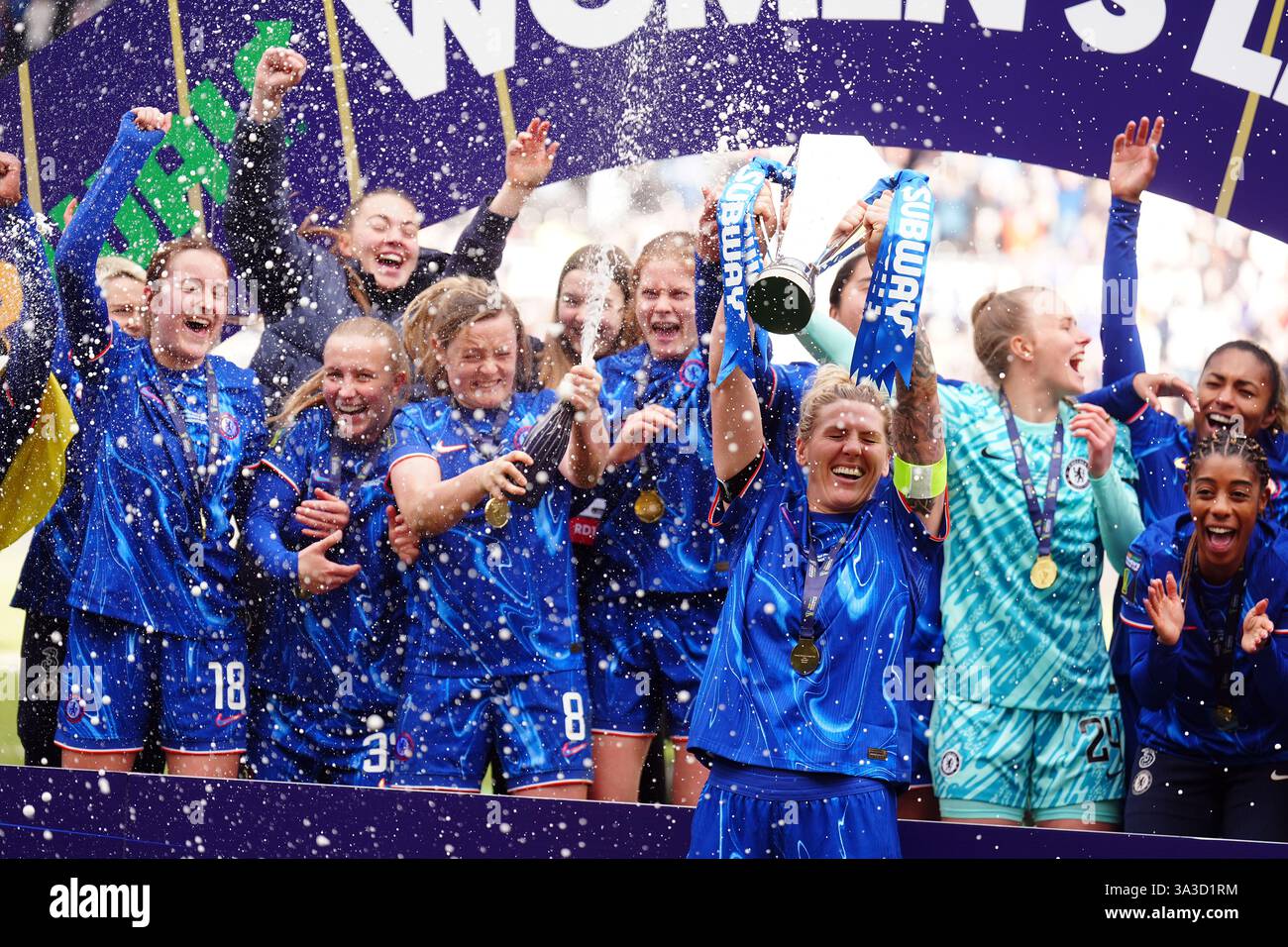 Chelsea's Millie Bright lifts the trophy after winning the Subway Women ...