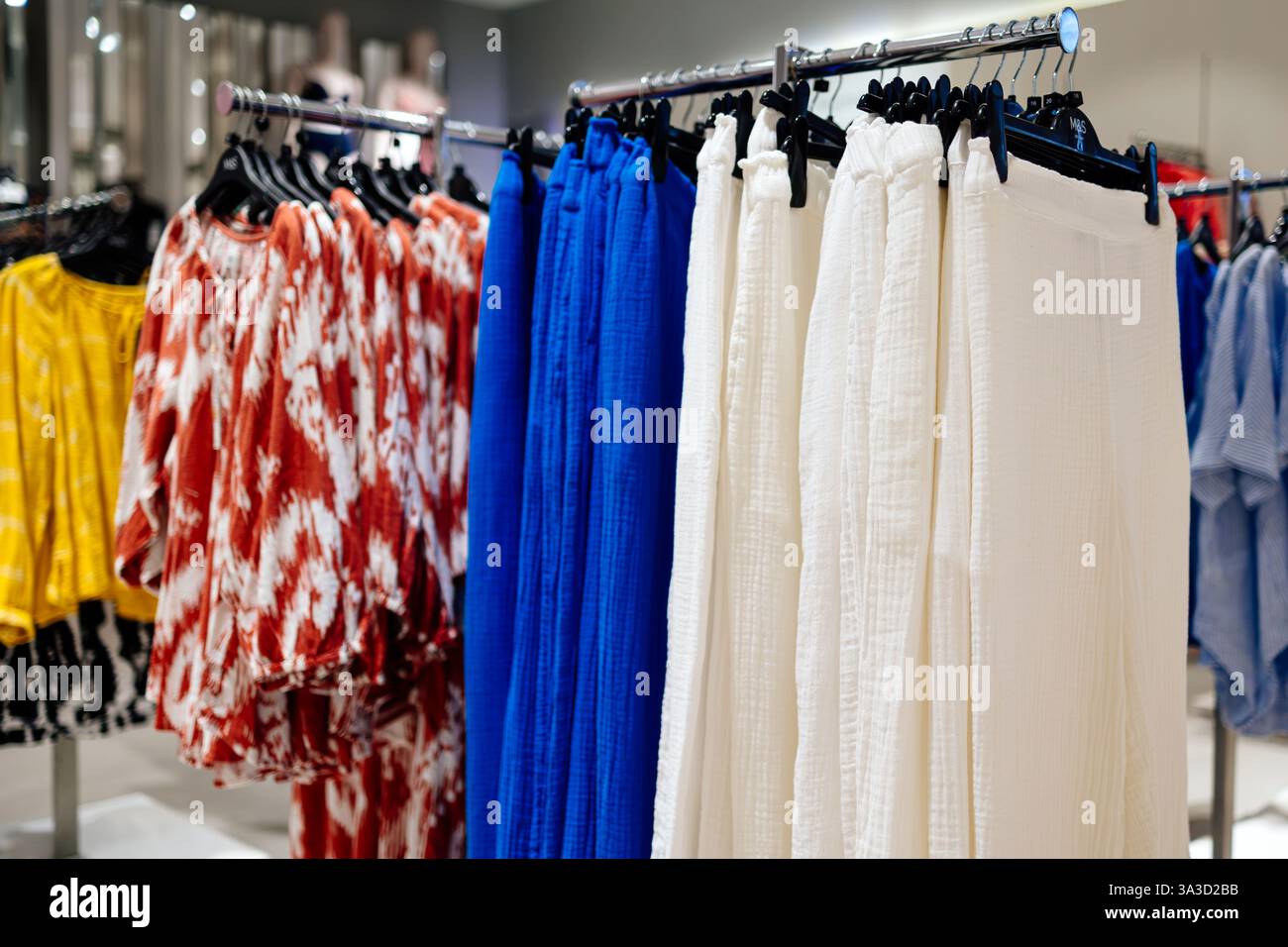 Women's clothing in a modern shopping center store. Shopping, clothing ...