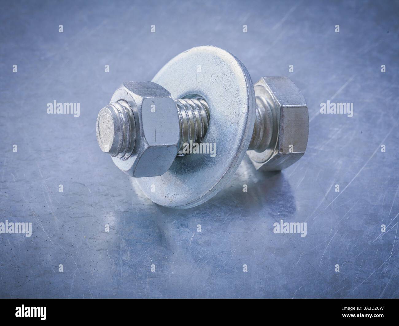 Threaded bolt washer screwbolt construction nuts on scratched metallic ...