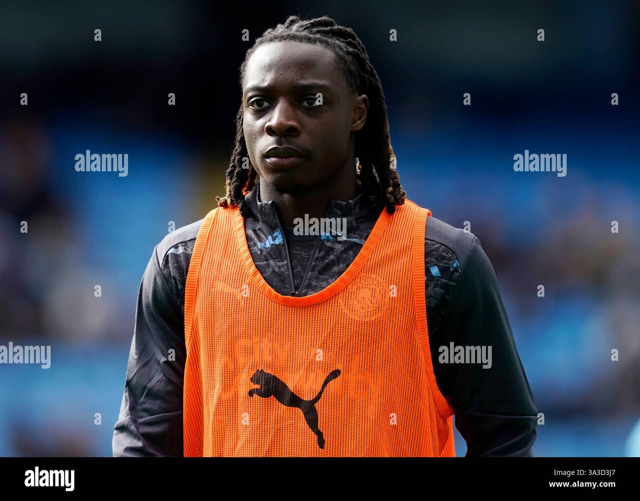 Manchester, UK. 15th Mar, 2025. Jeremy Doku of Manchester City warm up ...