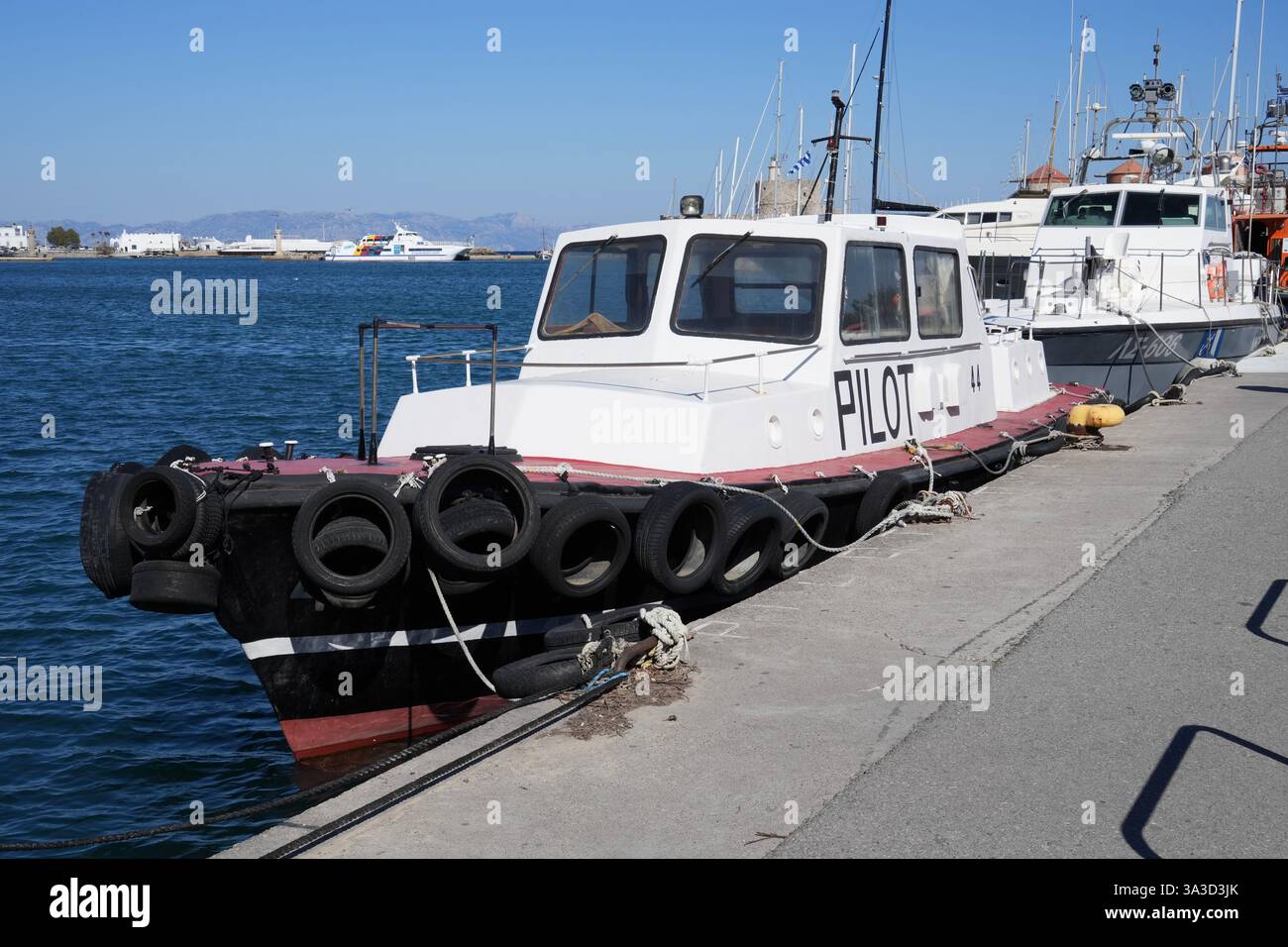 Pilot Boat in Mandraki Marina Stock Photo - Alamy