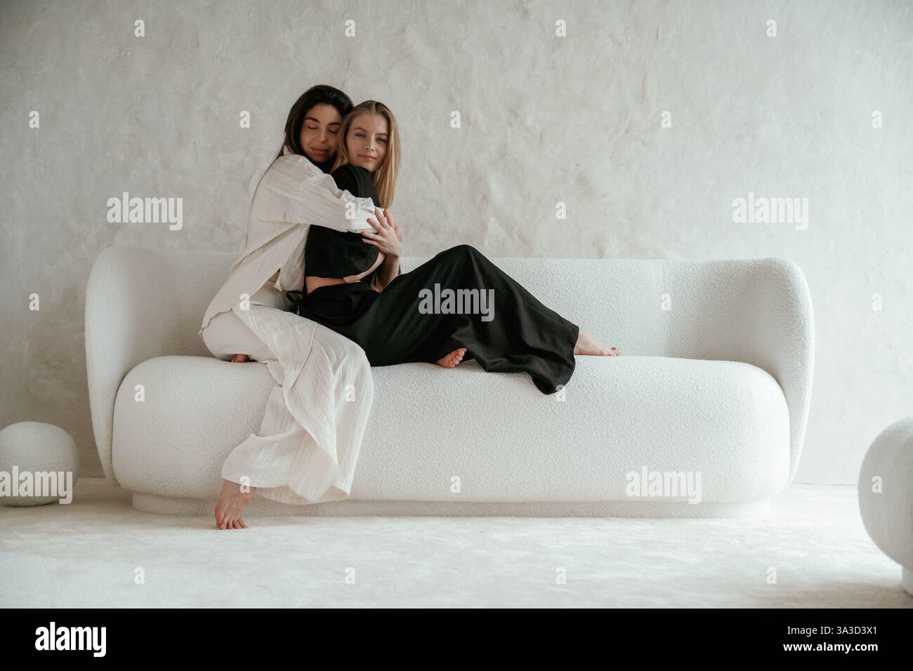 Moment of appreciation. Embracing the woman. Two happy young female ...