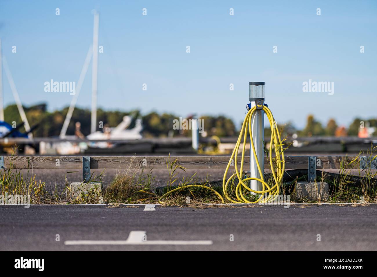 Utilities pole at a marina delivering electrical power and water ...