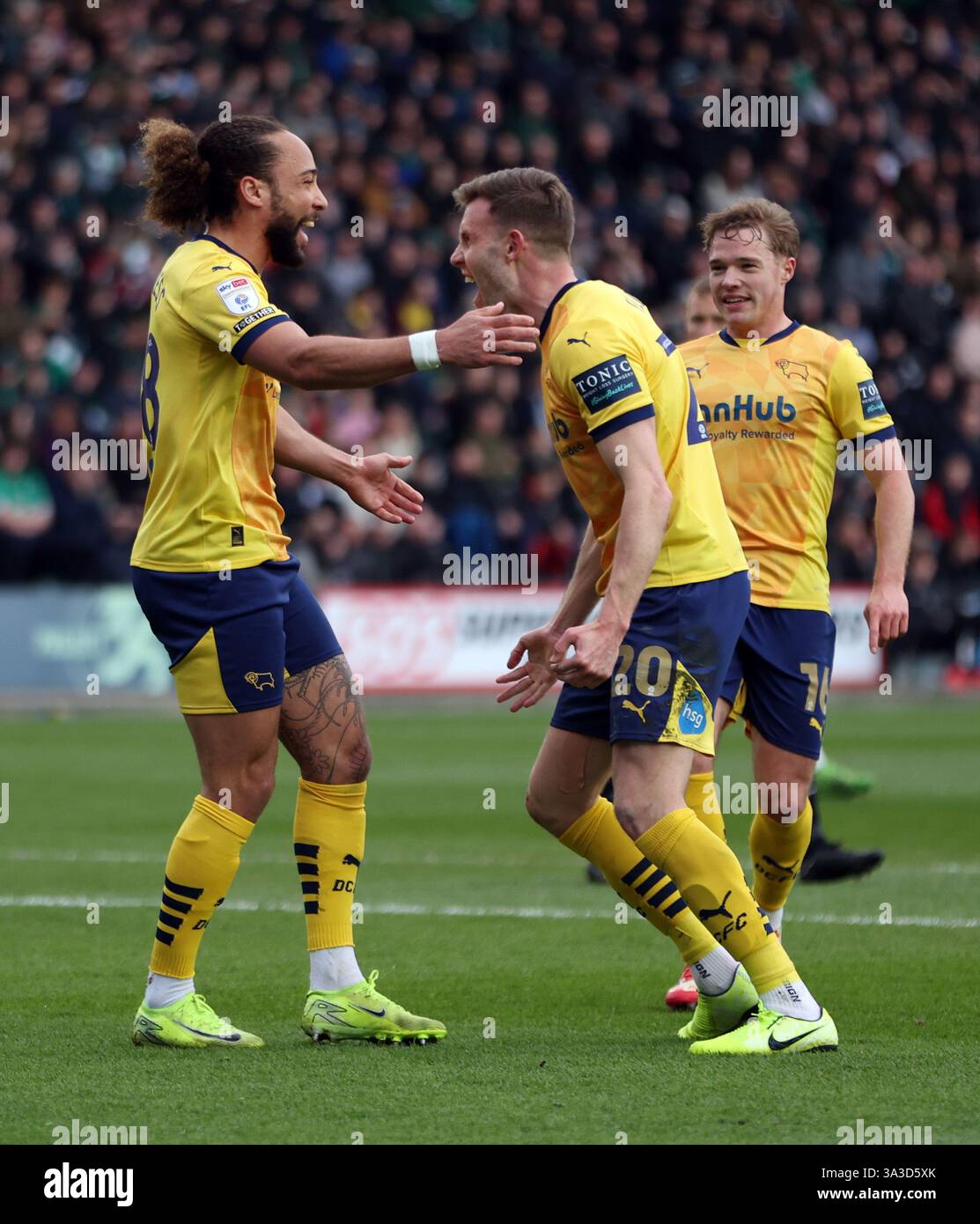 Derby County's Marcus Harness (left) celebrates scoring their side's ...