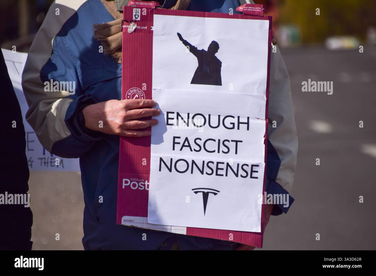 London, UK. 15th Mar, 2025. A protester holds an anti-Musk sign during ...