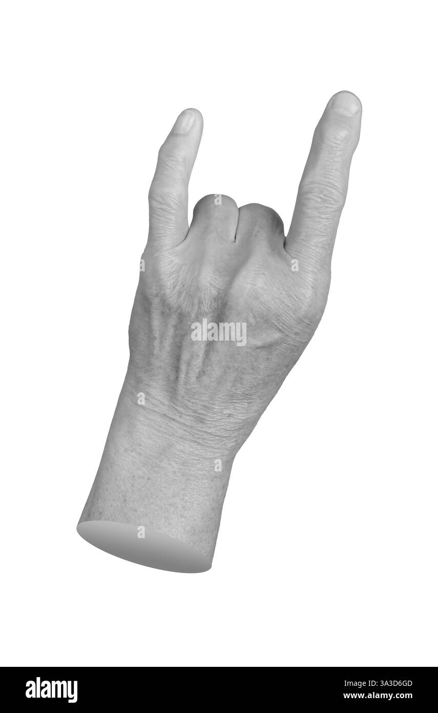Elderly hand making the rock on or devil horns gesture with index and ...