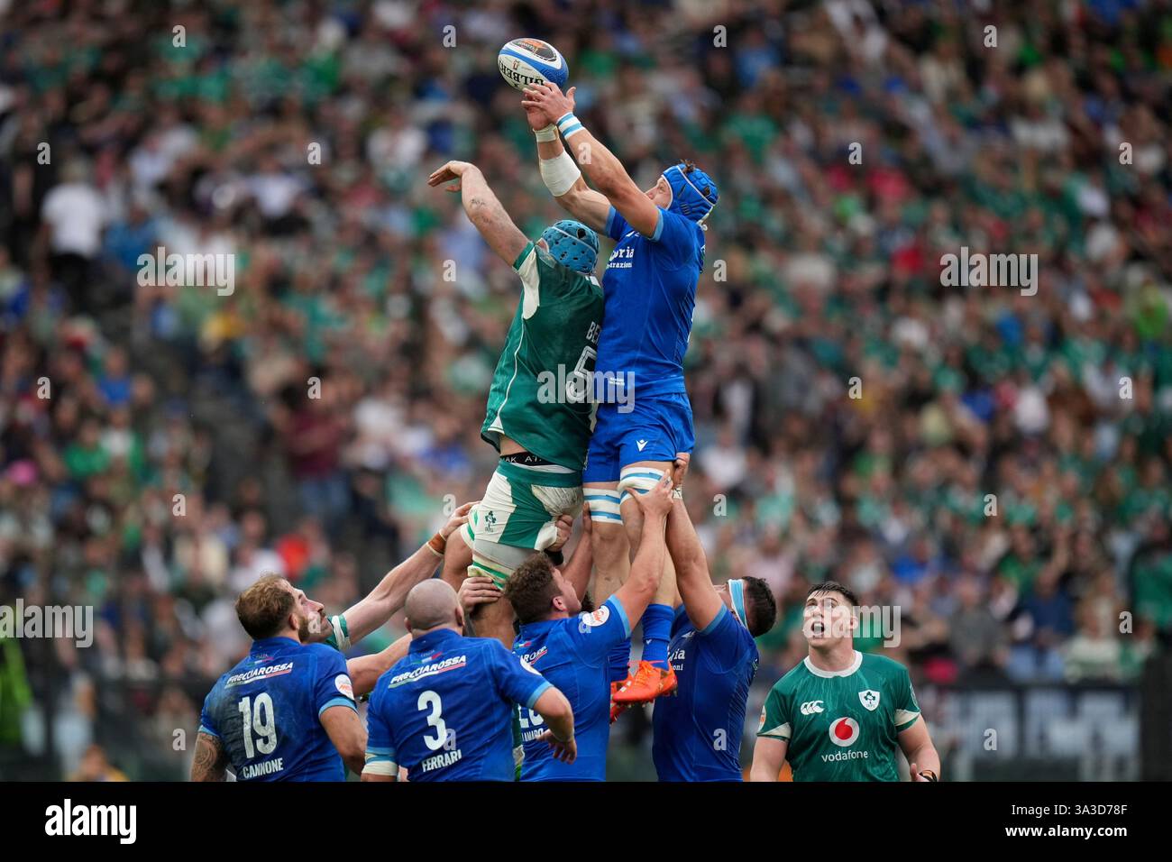 Italy's Ross Vintcent, top right, wins a line out against Ireland's ...