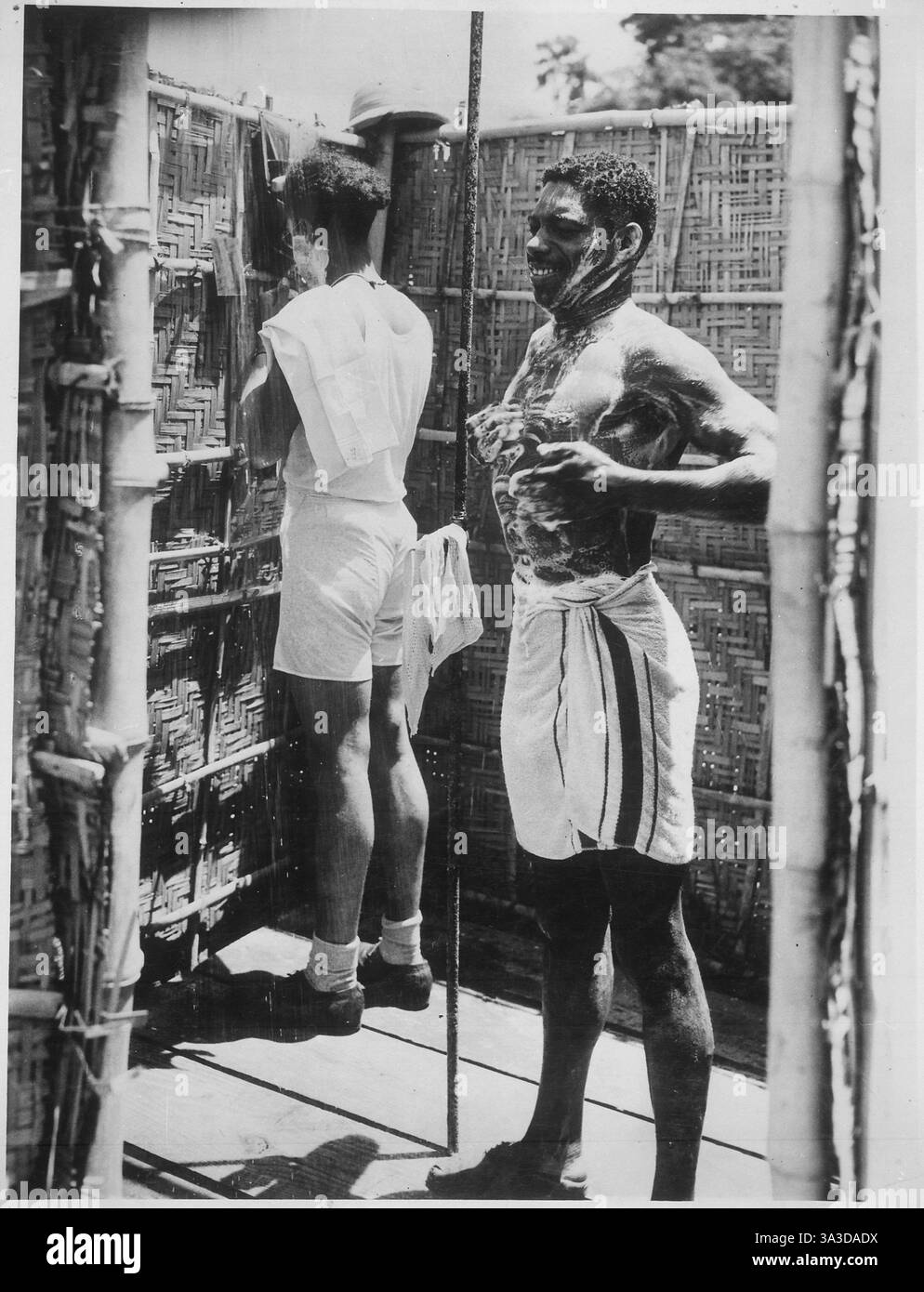 WWII african american soldier - "After a hard day's work a shower and ...
