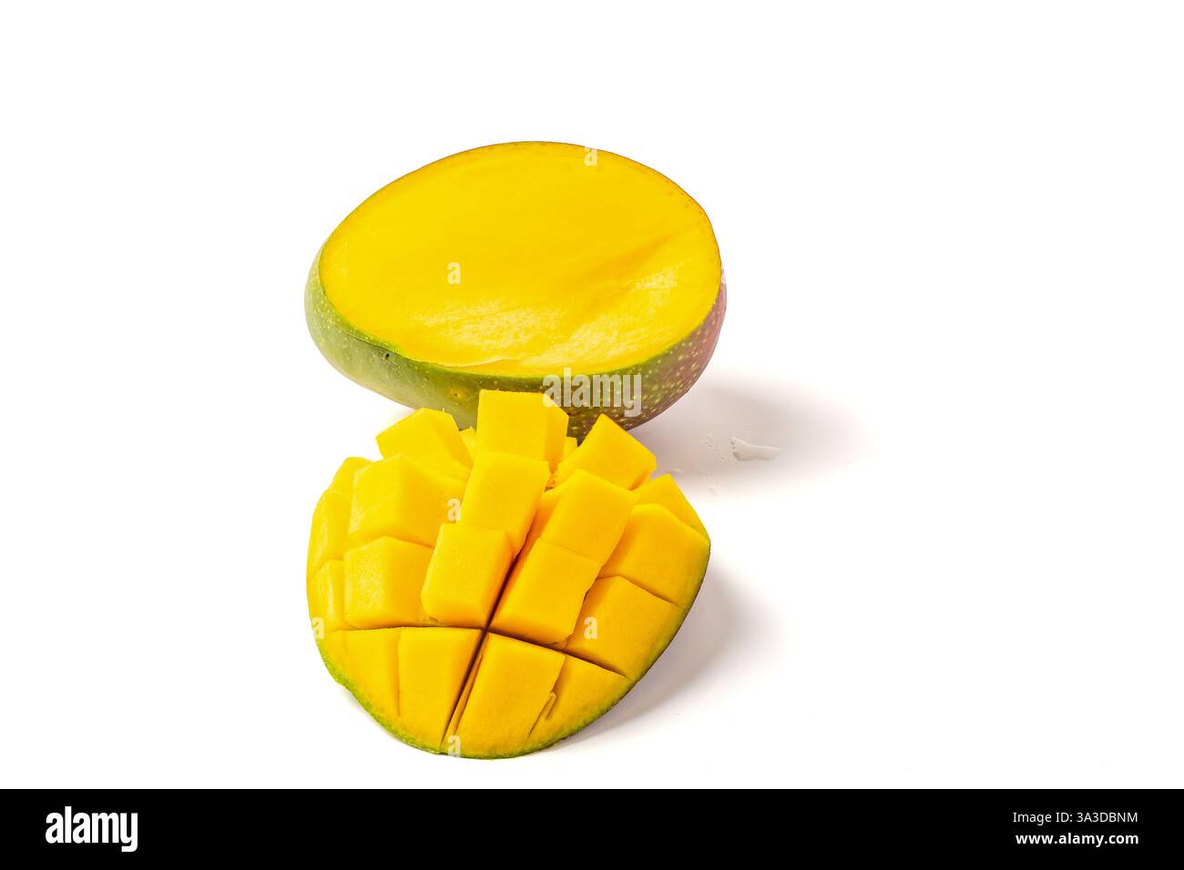 A slice of yellow mango with a green stem. The slice is cut in half ...