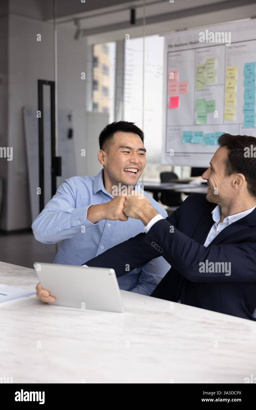 Two happy diverse business partners and friends enjoying effective ...
