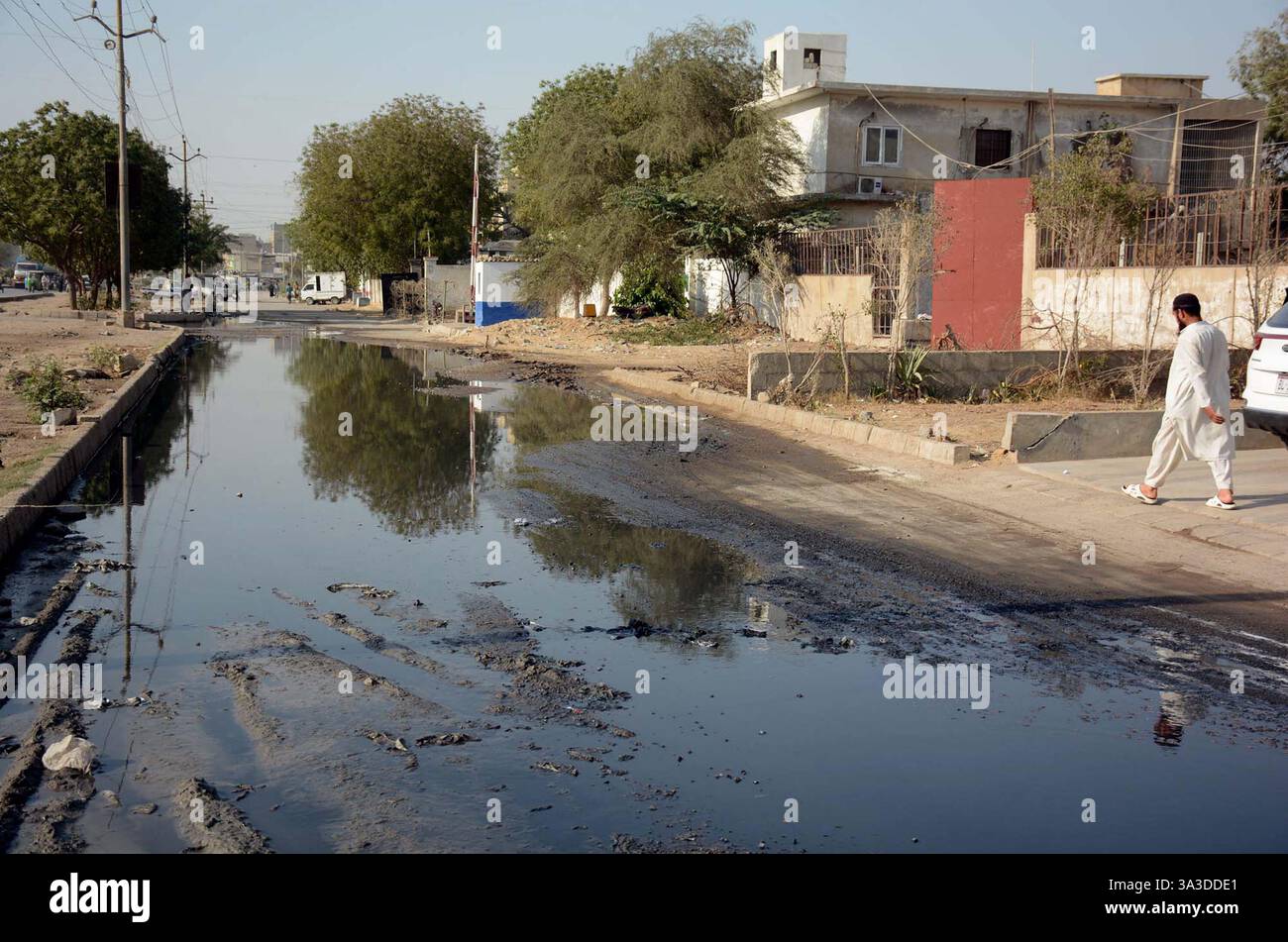 KARACHI, PAKISTAN, MAR 15: Inundated road by overflowing sewerage water ...