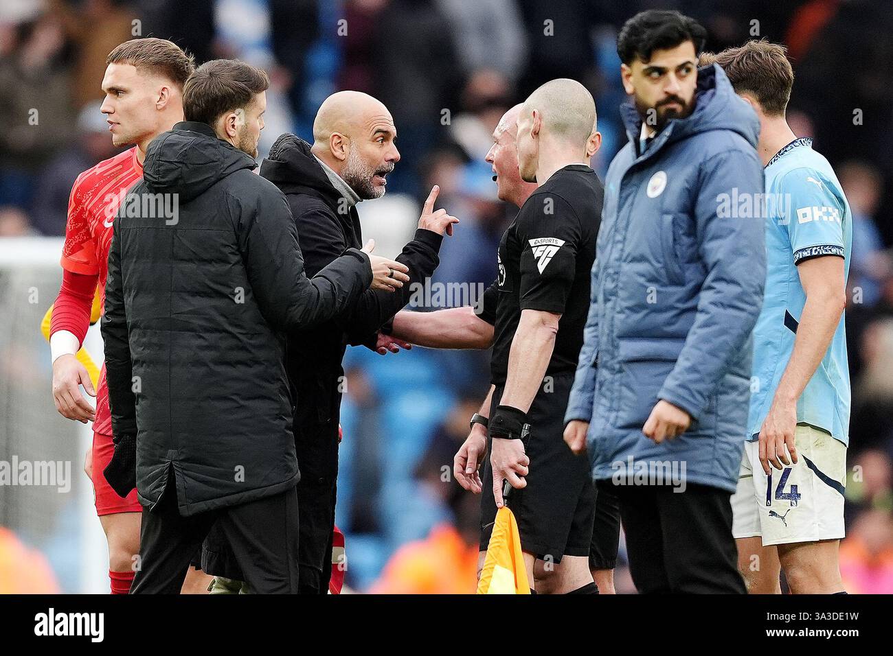 Manchester City manager Pep Guardiola (centre left) speaks to referee ...