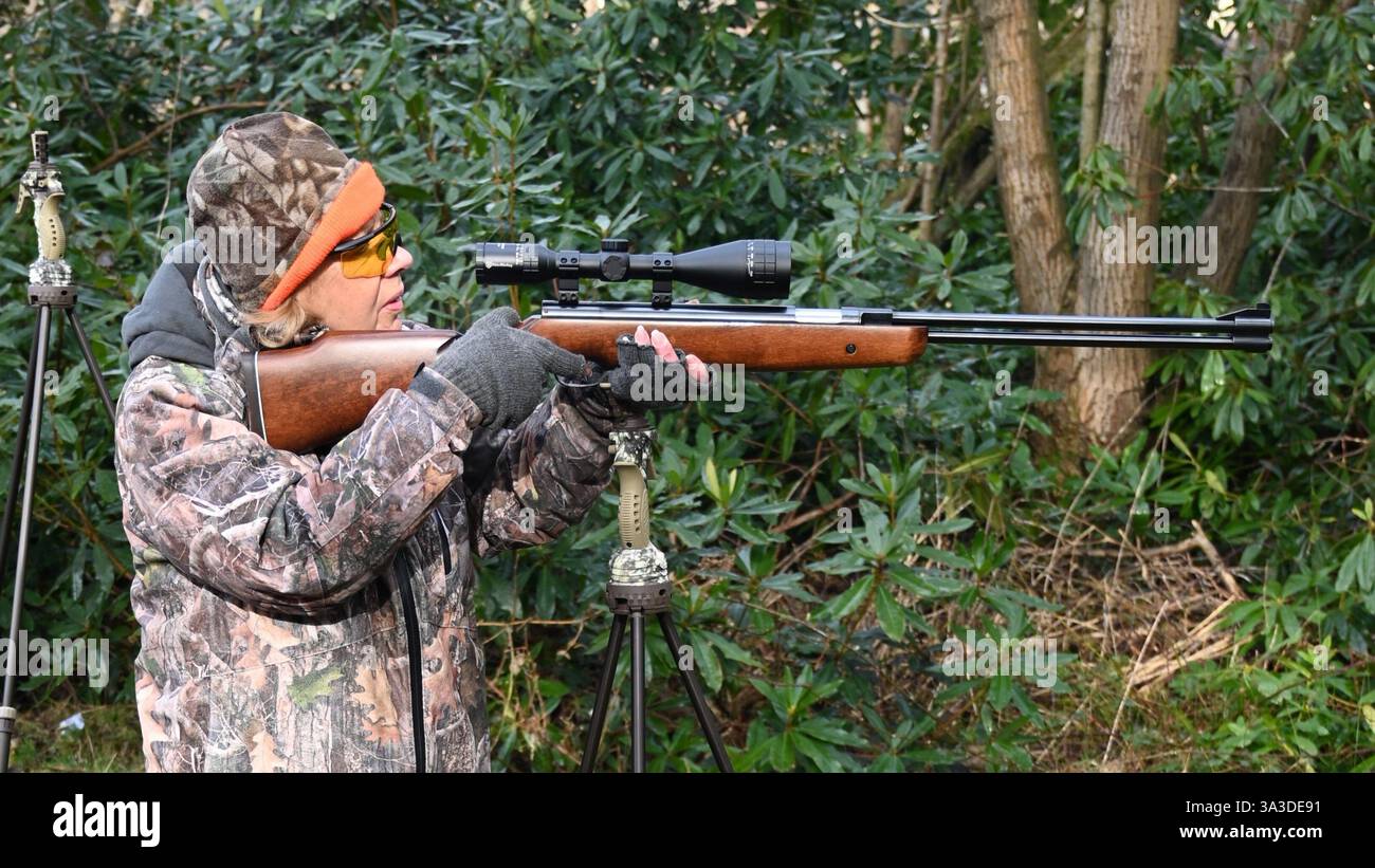 Lady shooting using a tripod Stock Photo - Alamy