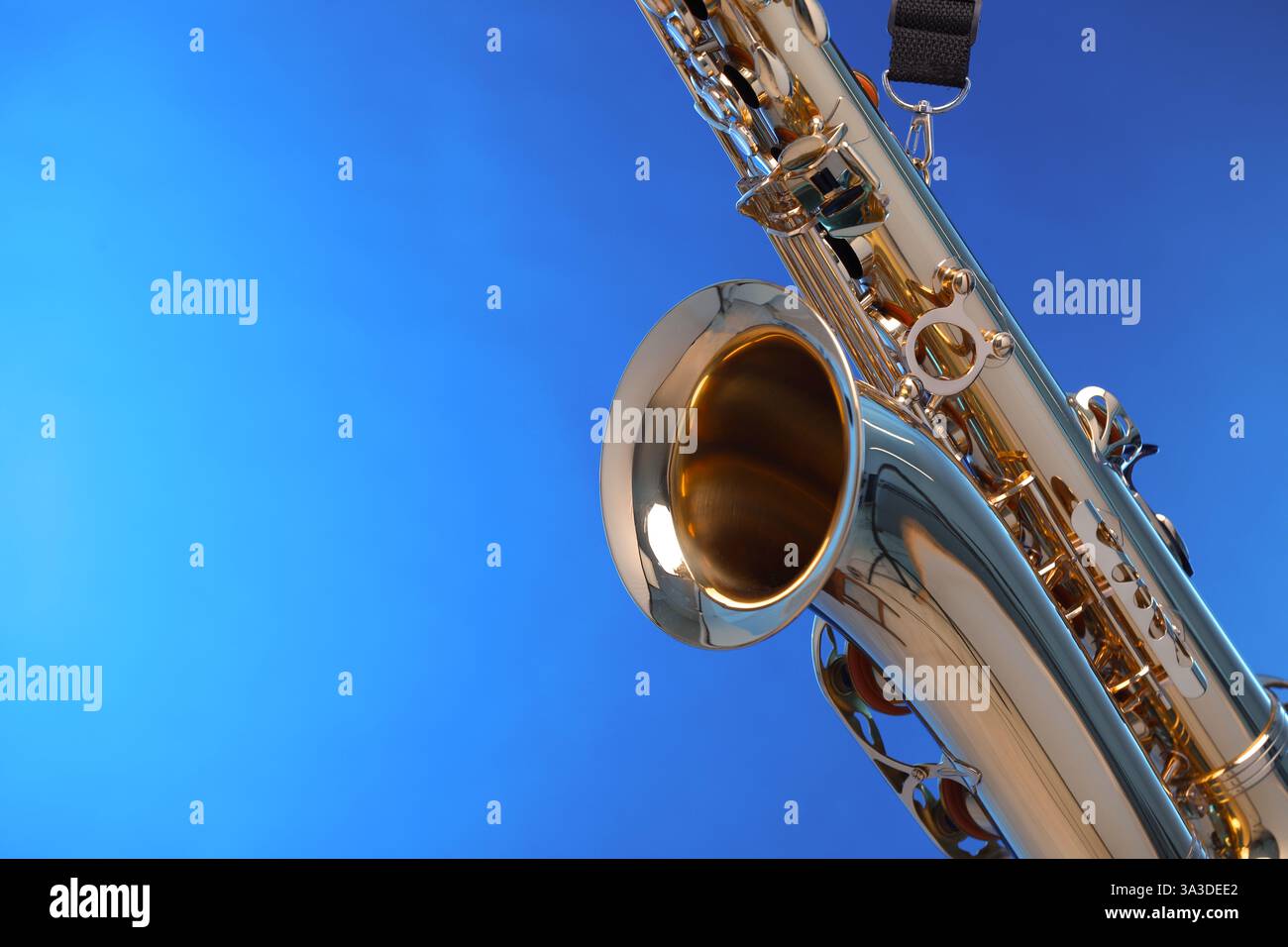 Golden shiny alto saxophone blue hi-res stock photography and images ...