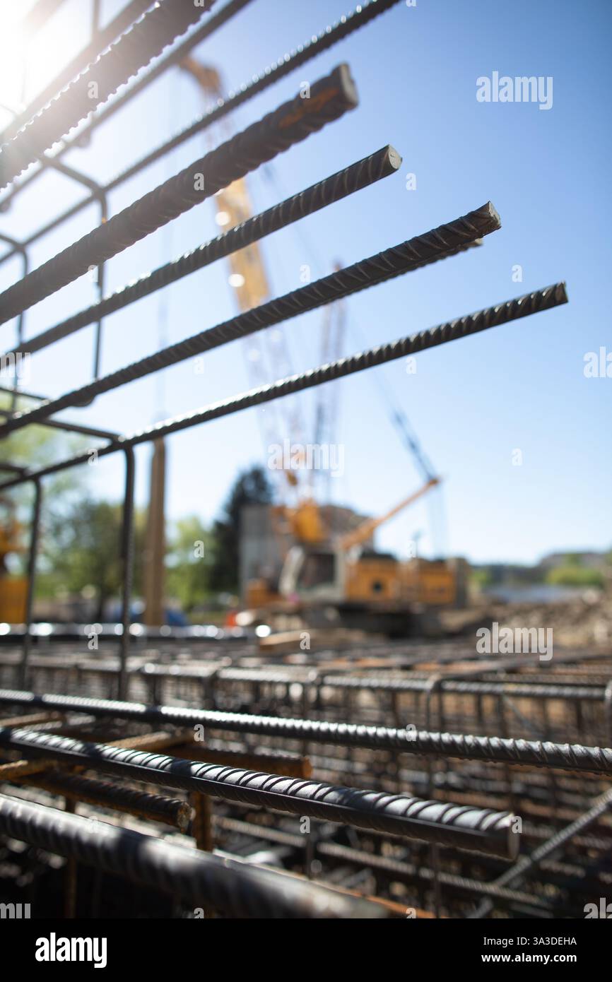 A Construction Site Featuring Reinforcement Bars, Heavy Machinery and ...