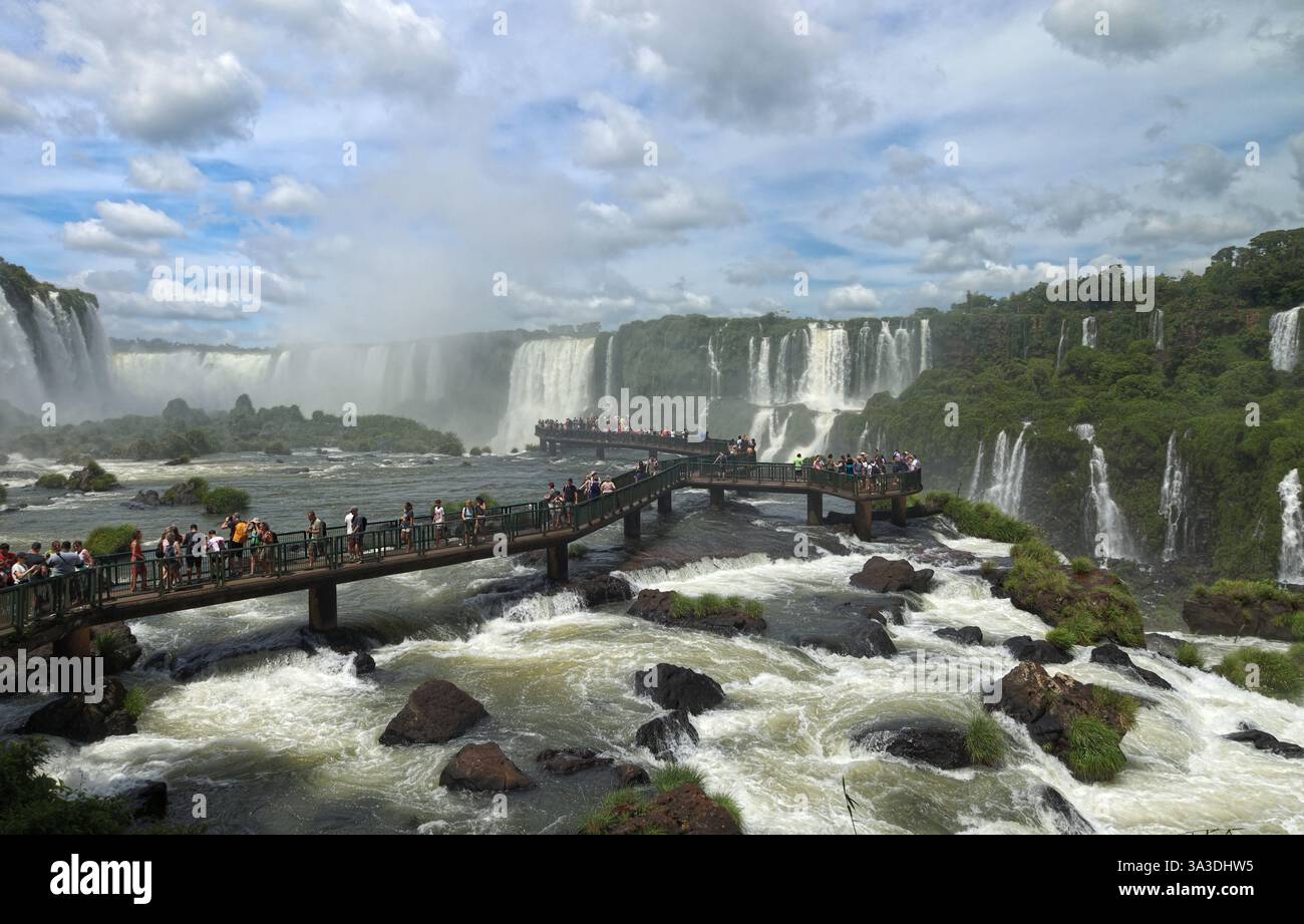 Iguazu Falls, Argentina and Brazil - tourists on walkway viewing ...