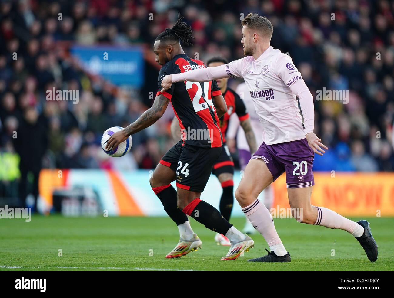 Bournemouth's Antoine Semenyo (centre) battles for the ball against ...