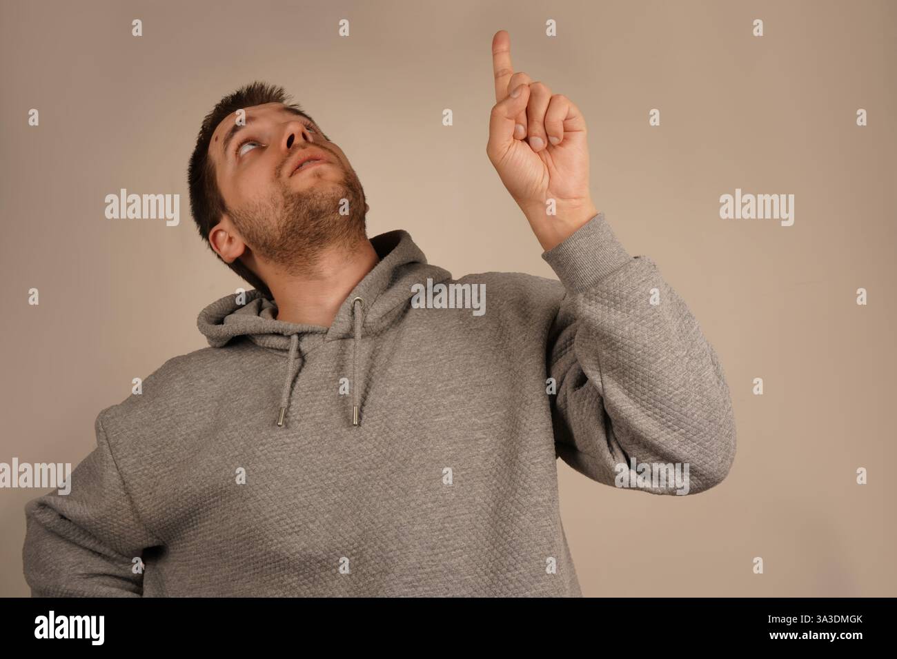 The gesture draws attention and conveys urgency. With a single raised ...