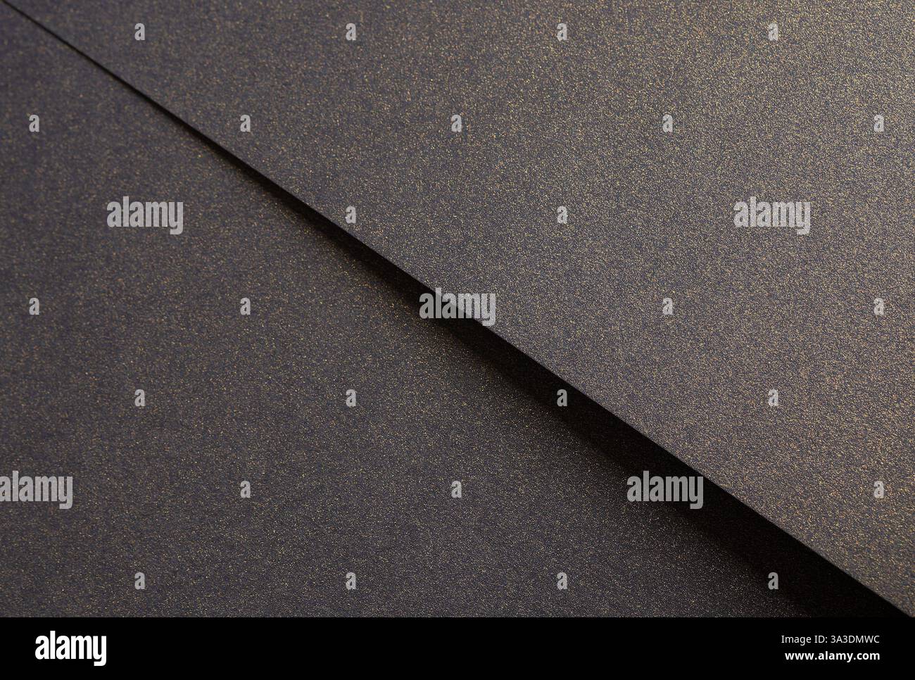 Elegant black paper texture with a shimmering golden sparkle and grainy ...