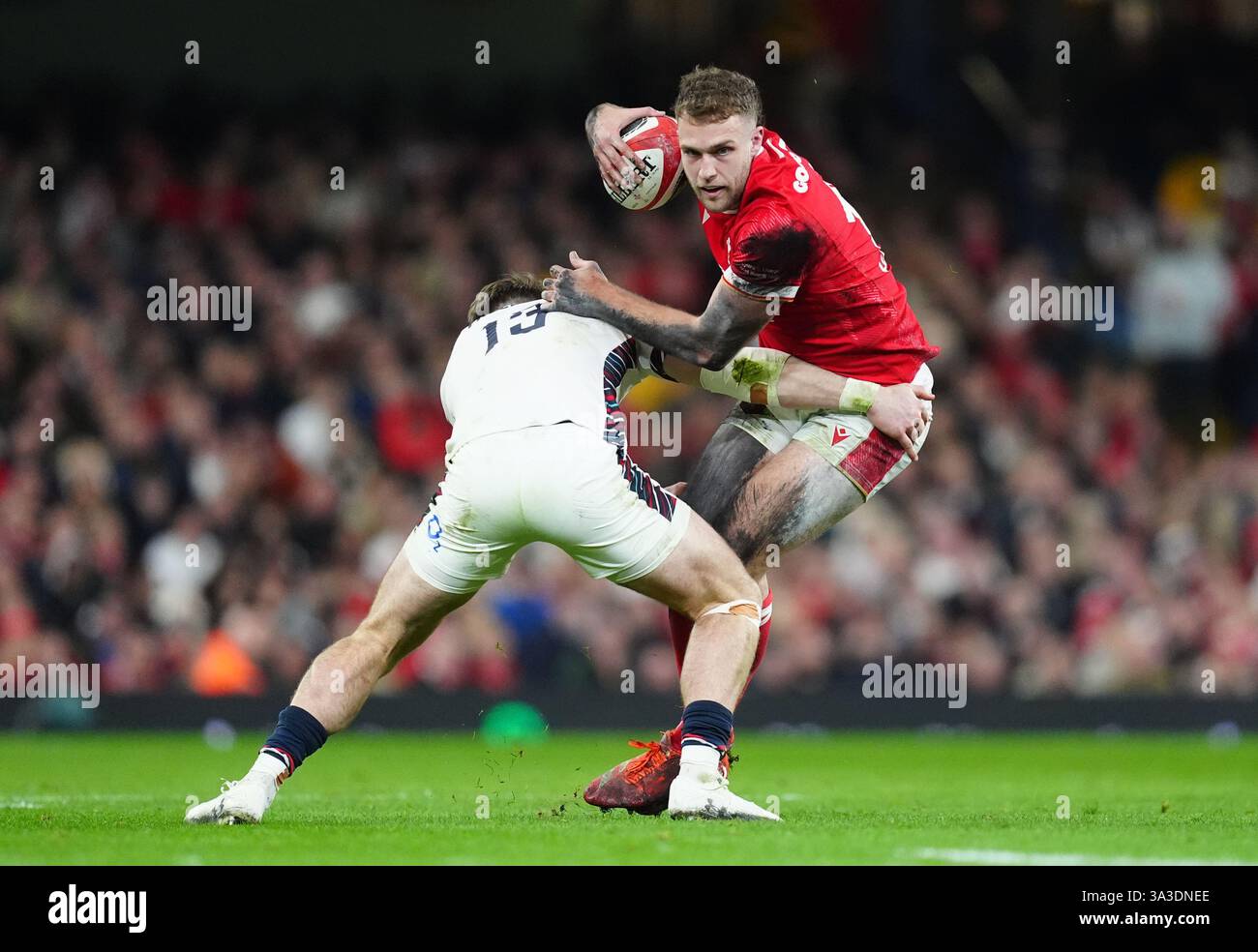 England's Tommy Freeman tackles Wales' Max Llewellyn during the ...