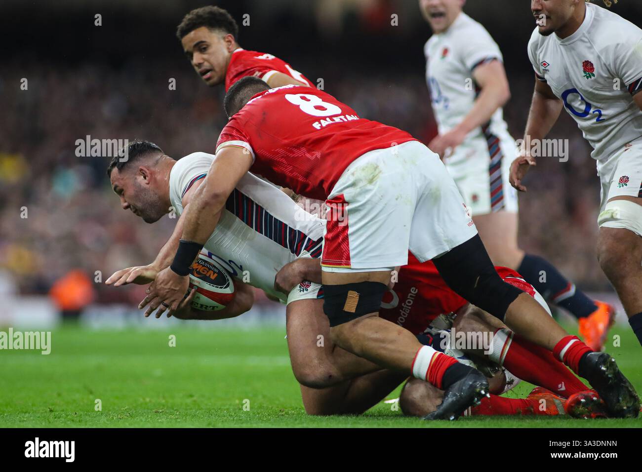 Cardiff, UK. 15th Mar, 2025. Ellis Genge of England is tackled by ...