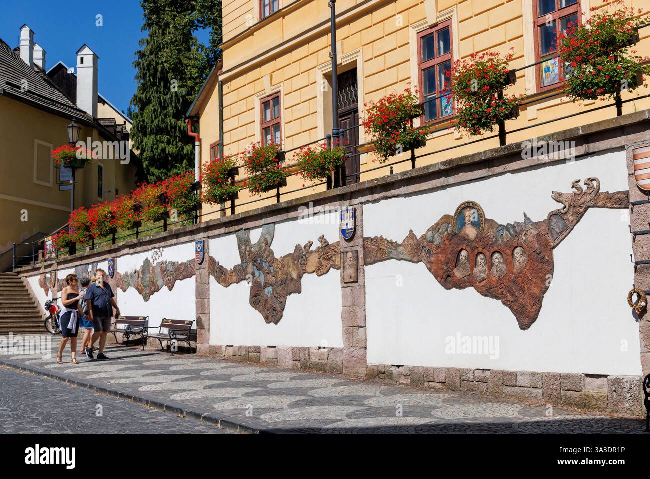 Artwork frieze on wall showing historical people including M. Theresia ...